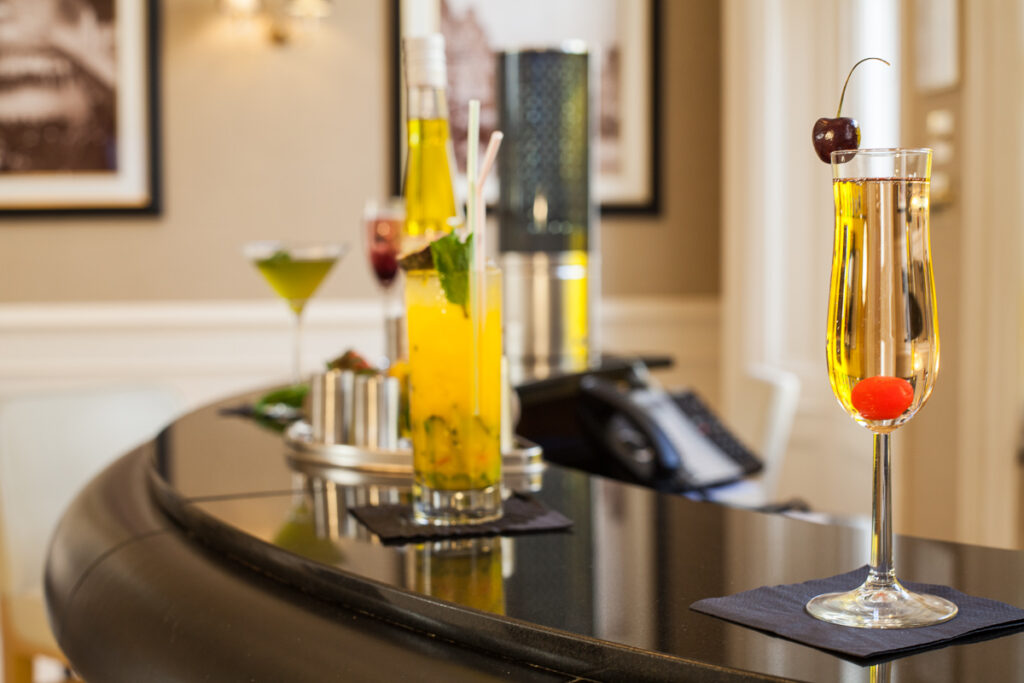 Relax at the Grand Bar with a selection of drinks and light bites in a ...